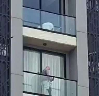 American accused of violating son on balcony was saving him from ...
